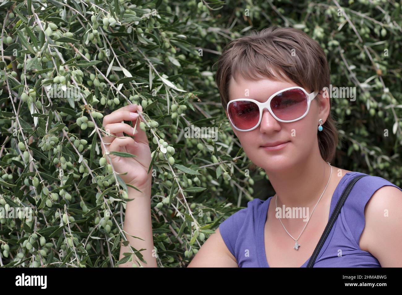 The woman poses in olive plantation, Crete, Greece Stock Photo - Alamy