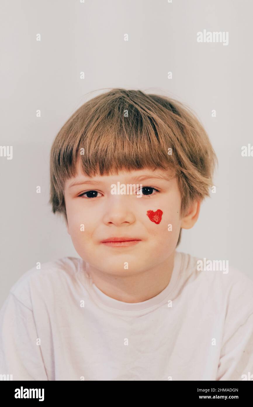 Kid with heart at the cheek Stock Photo - Alamy
