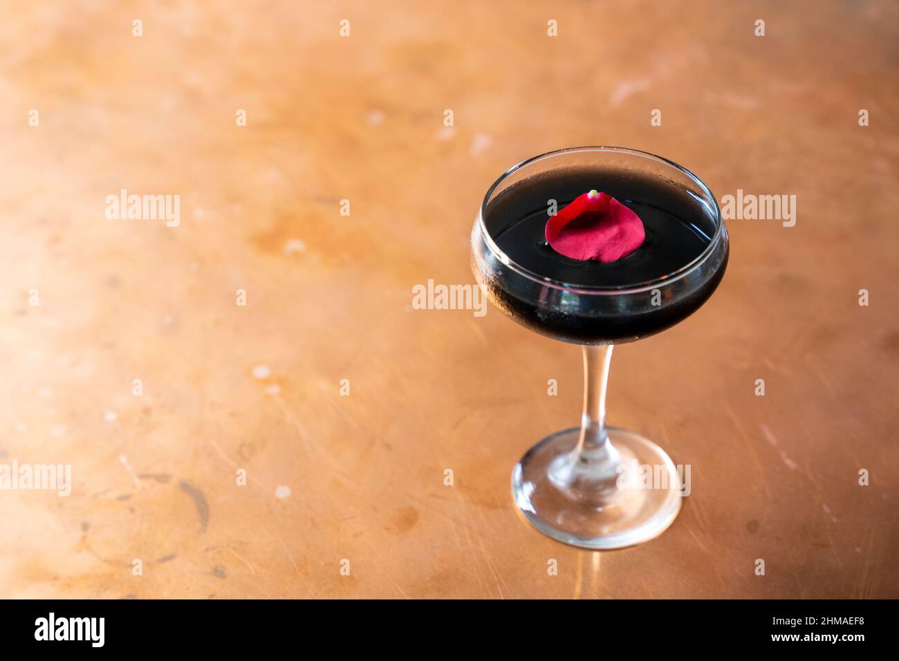 Brandy cocktail with a rose petal garnish Stock Photo - Alamy