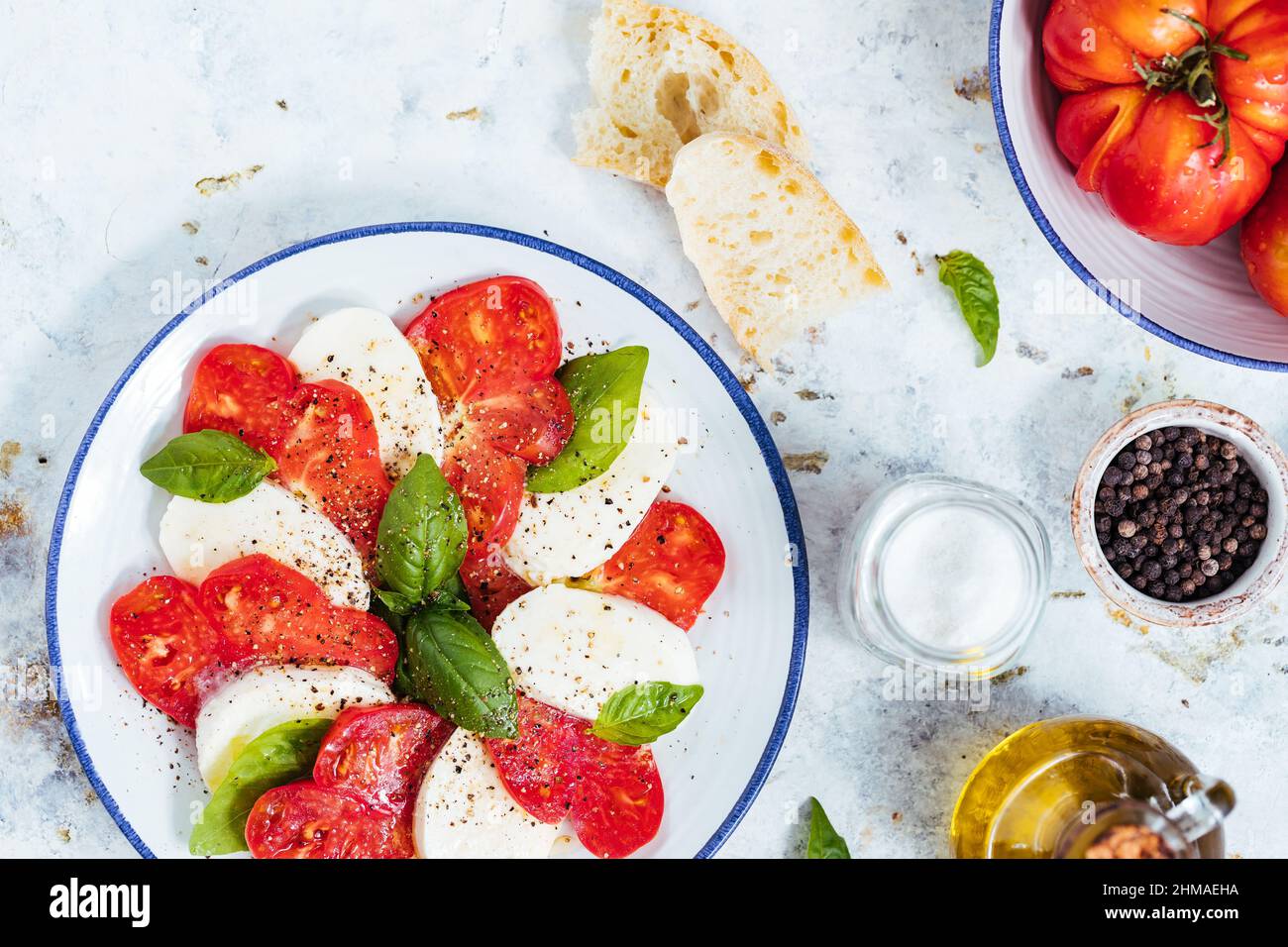 Fresh Caprese salad with mozzarella, tomato and fresh basil with olive ...