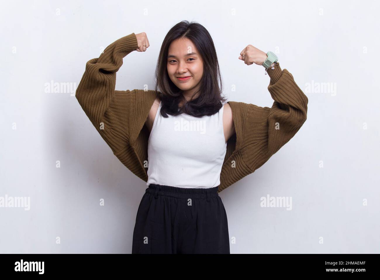 Gorgeous strong young asian woman happy and excited celebrating victory ...