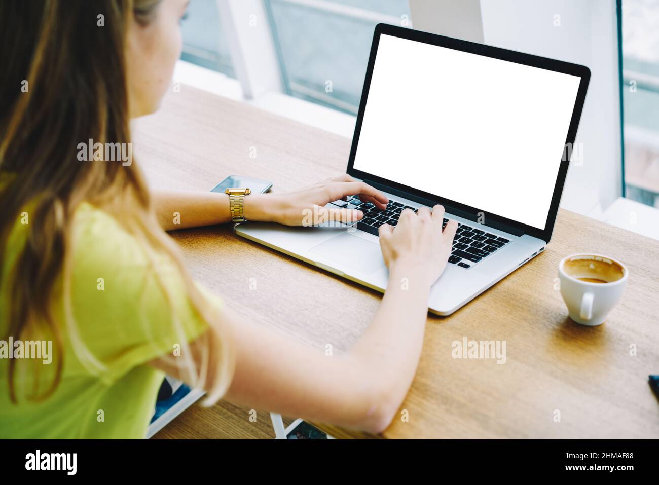 Female freelancer working on computer in cafe Stock Photo - Alamy