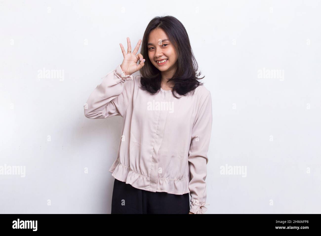 young asian beautiful woman with ok sign gesture tumb up isolated on white background Stock ...