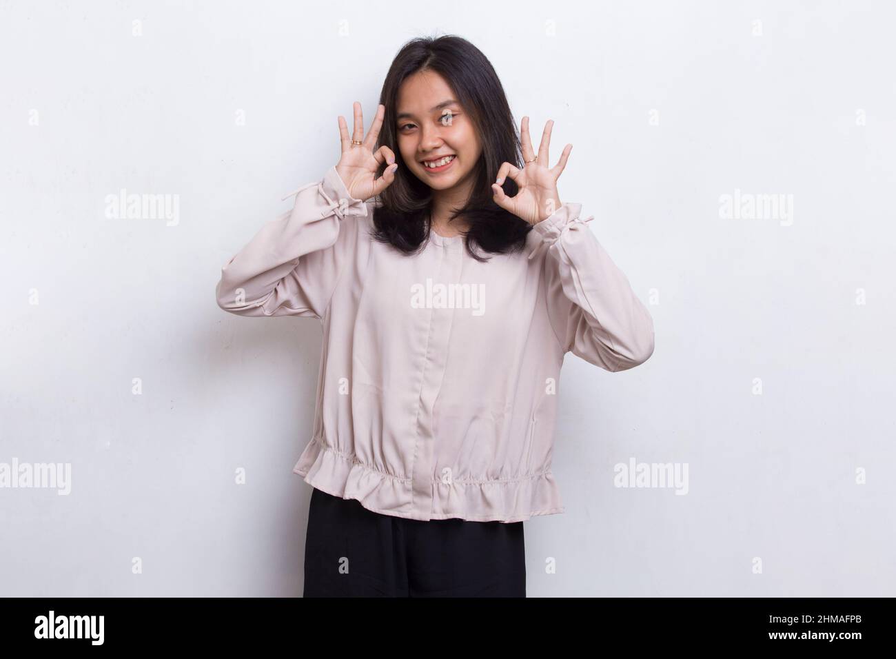 young asian beautiful woman with ok sign gesture tumb up isolated on white background Stock ...