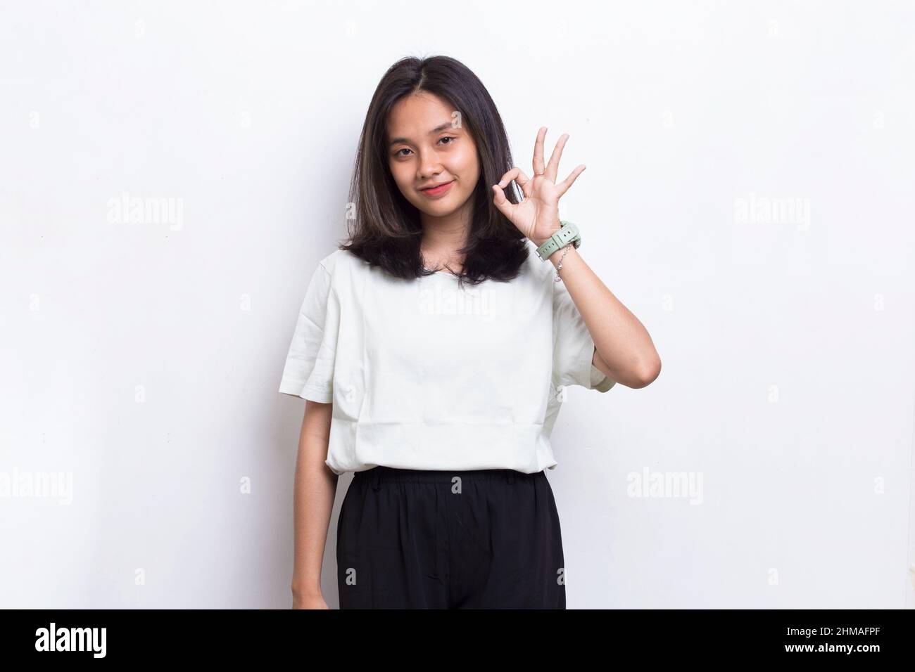 young asian beautiful woman with ok sign gesture tumb up isolated on white background Stock ...