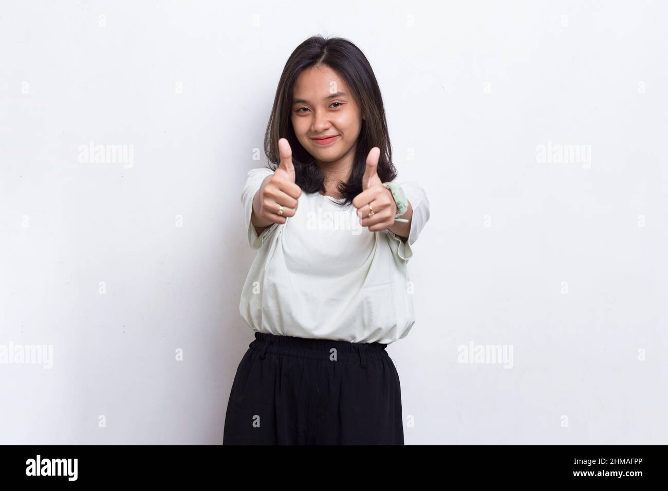 young asian beautiful woman with ok sign gesture tumb up isolated on white background Stock ...
