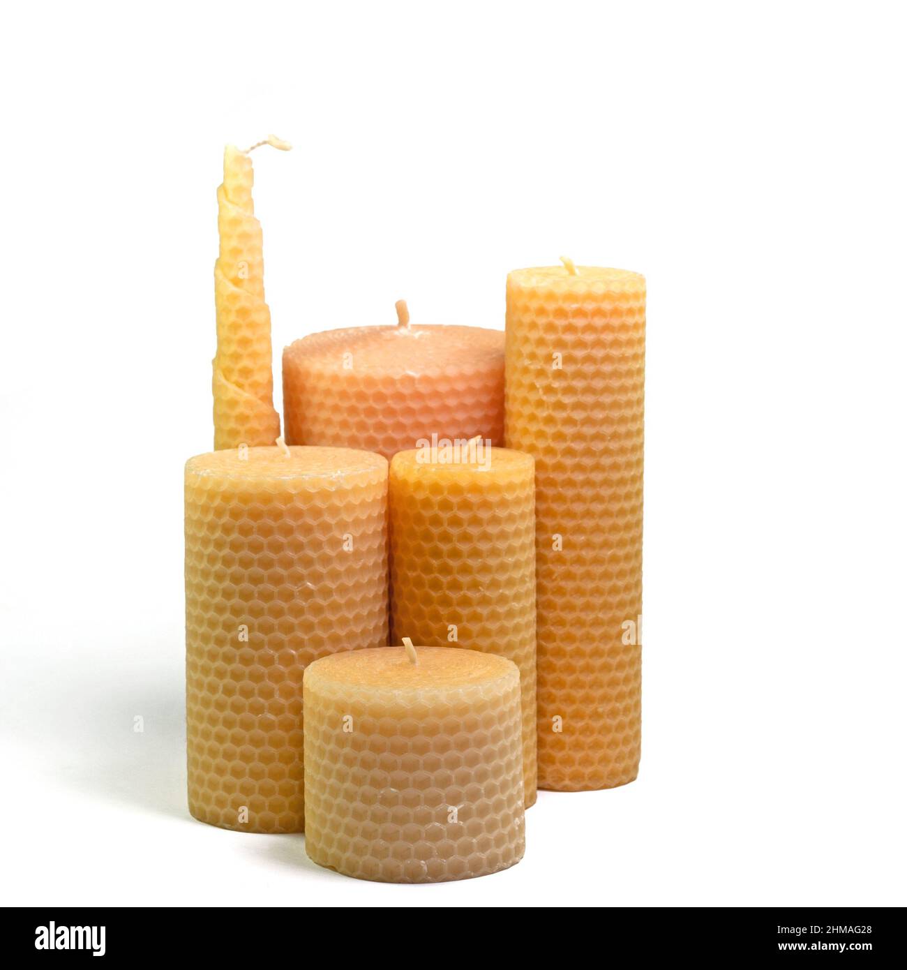 Beeswax candles against a white background Stock Photo - Alamy