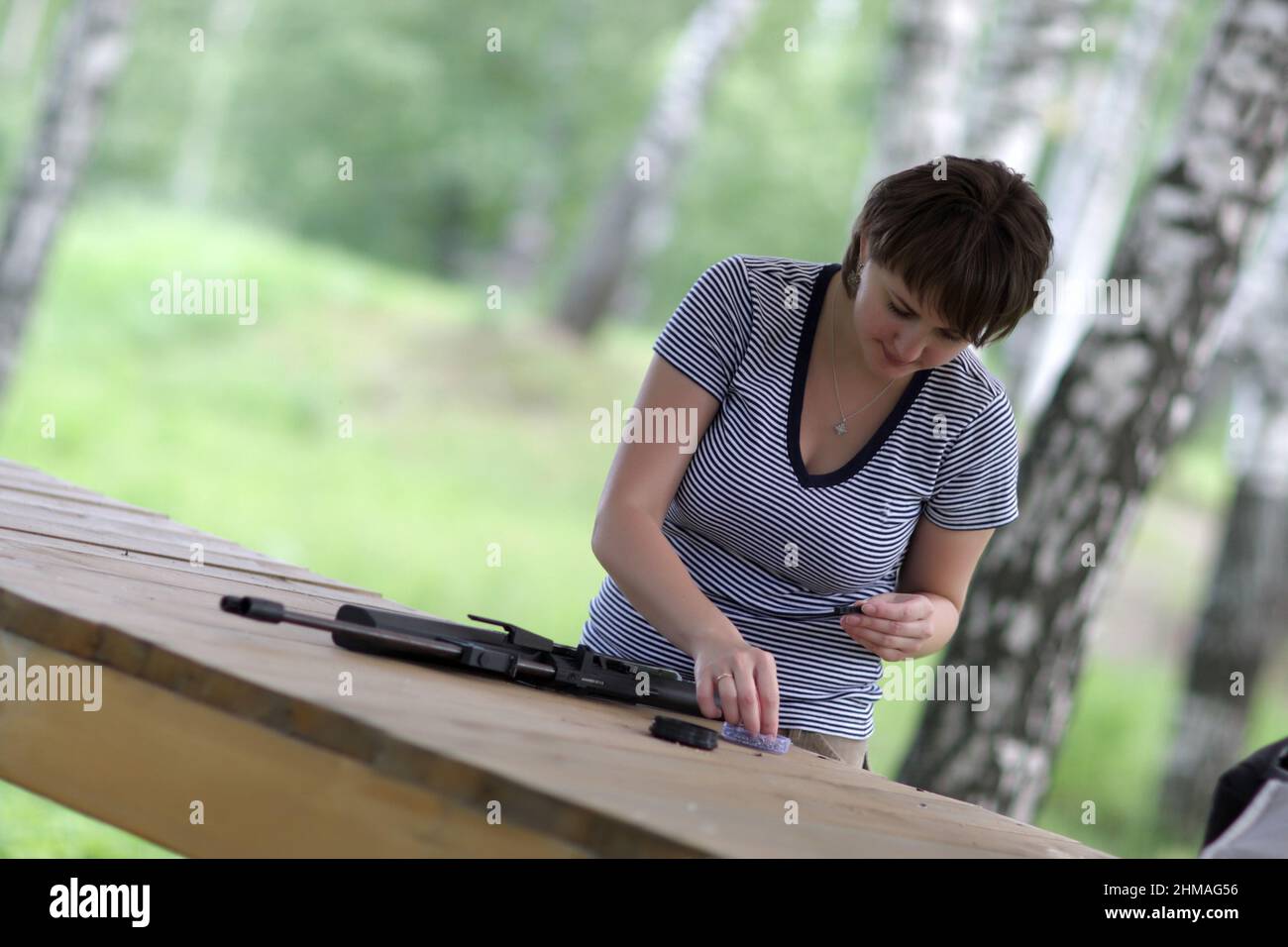 Woman loading gun hi-res stock photography and images - Alamy