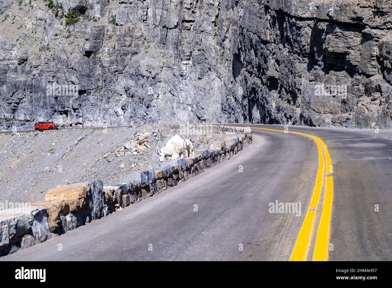 Montana, USA - July 1, 2021: A red jammer tour bus filled with tourists ...