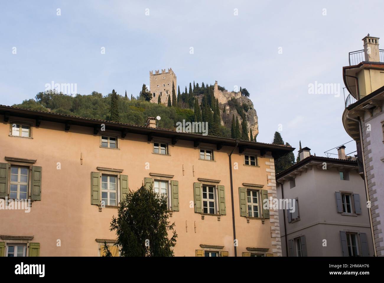 The ruins of Arco Castle overlook residential buildings in the small ...