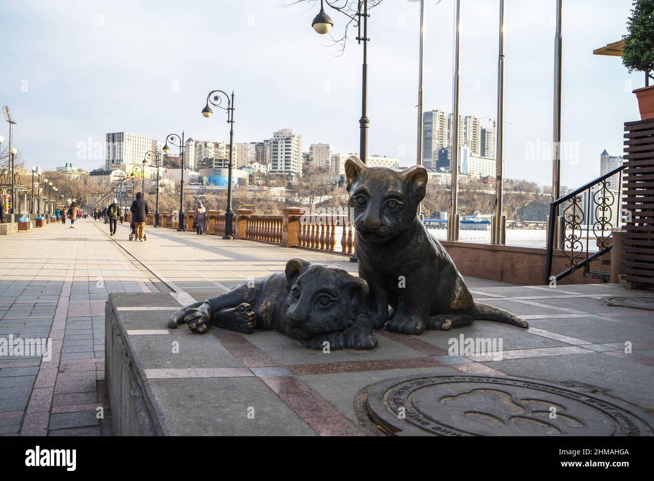 Bronze monument to Amur tiger cubs on the city promenade on the ...