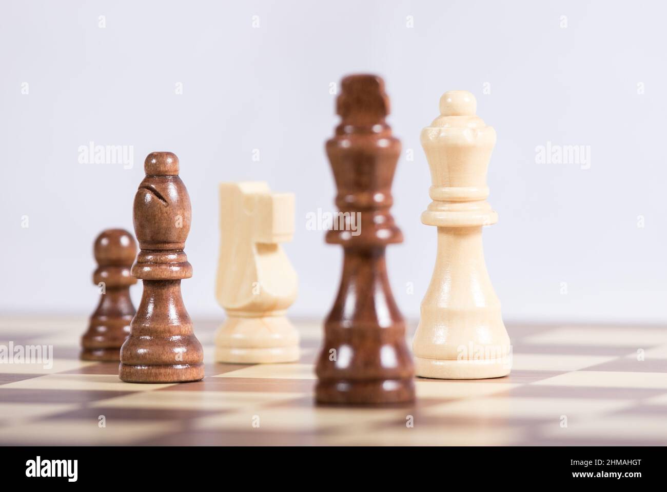 Chess game being played with a light background Stock Photo - Alamy