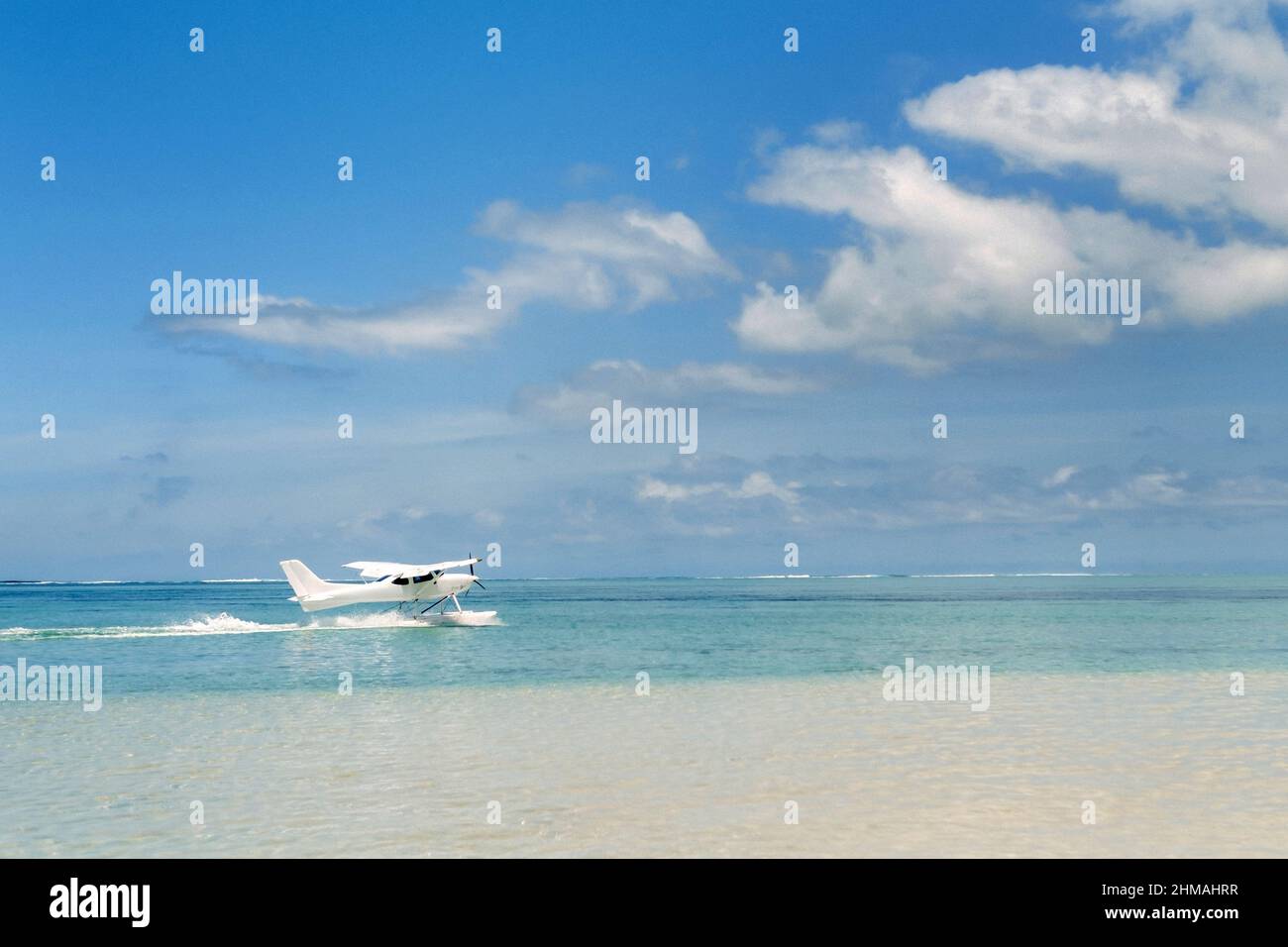 Seaplane begins to take off on the island of Mauritius in the Indian ...