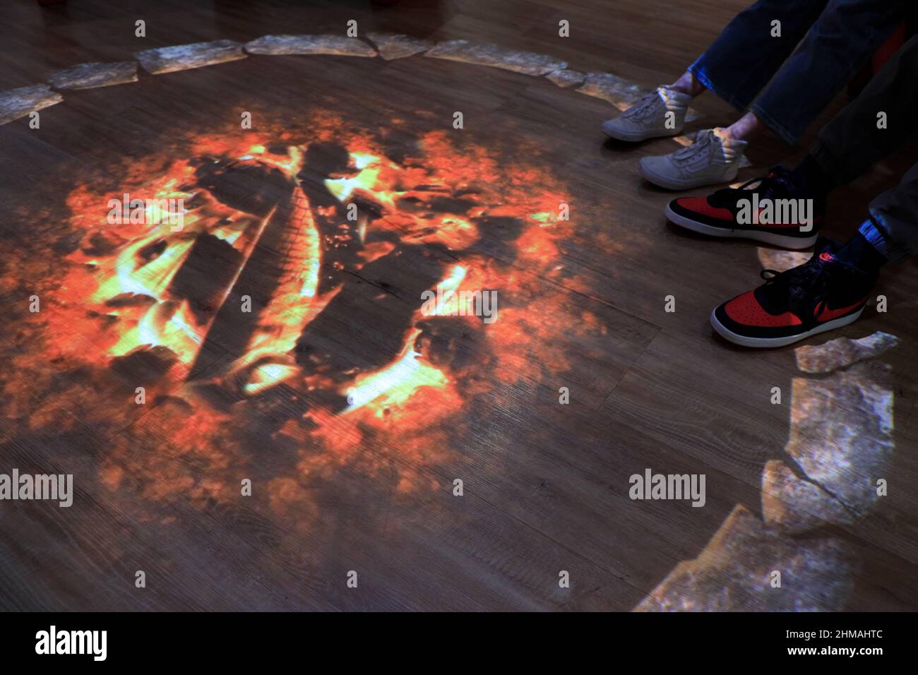 Projected images of a bonfire on the floor of Native American Voice ...