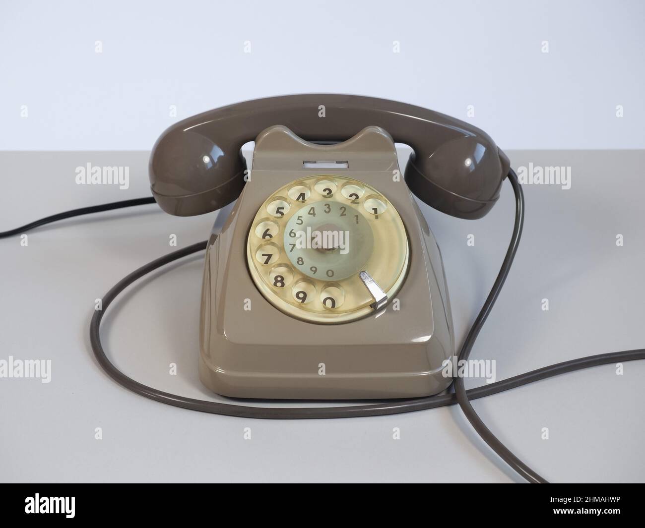 Vintage grey rotary dial analog landline telephone Stock Photo - Alamy