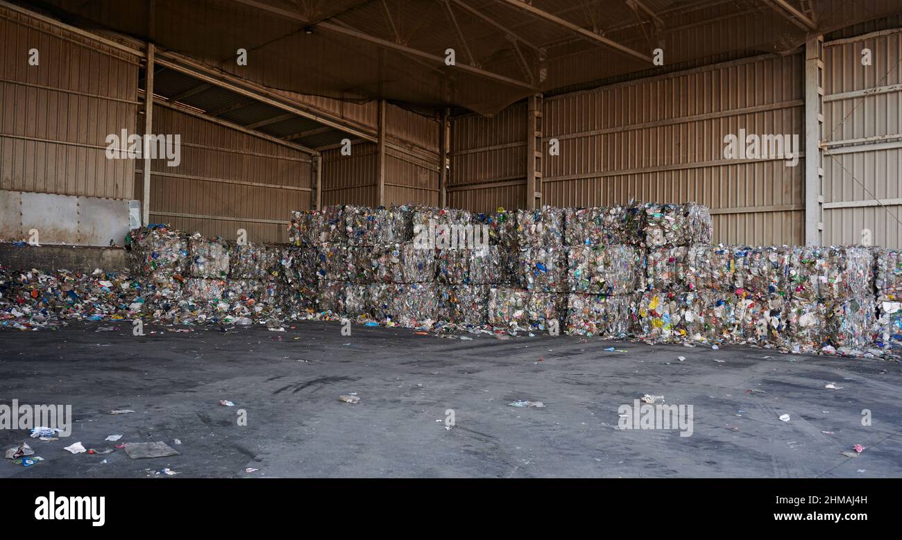View of crushed waste in cubes ready for waste disposal Stock Photo - Alamy