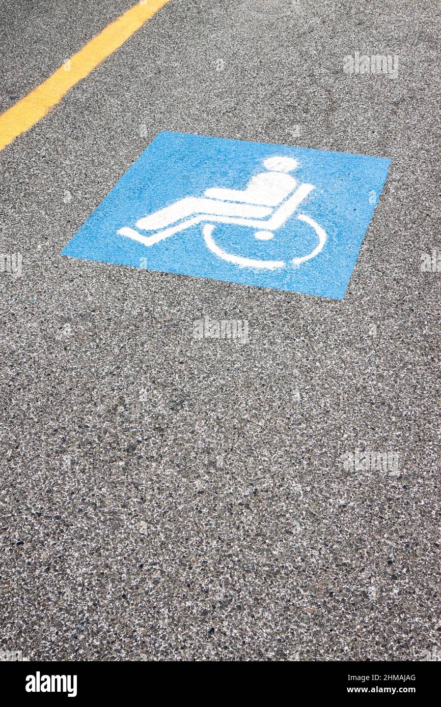Symbol of the handicapped person painted on the asphalt Stock Photo - Alamy