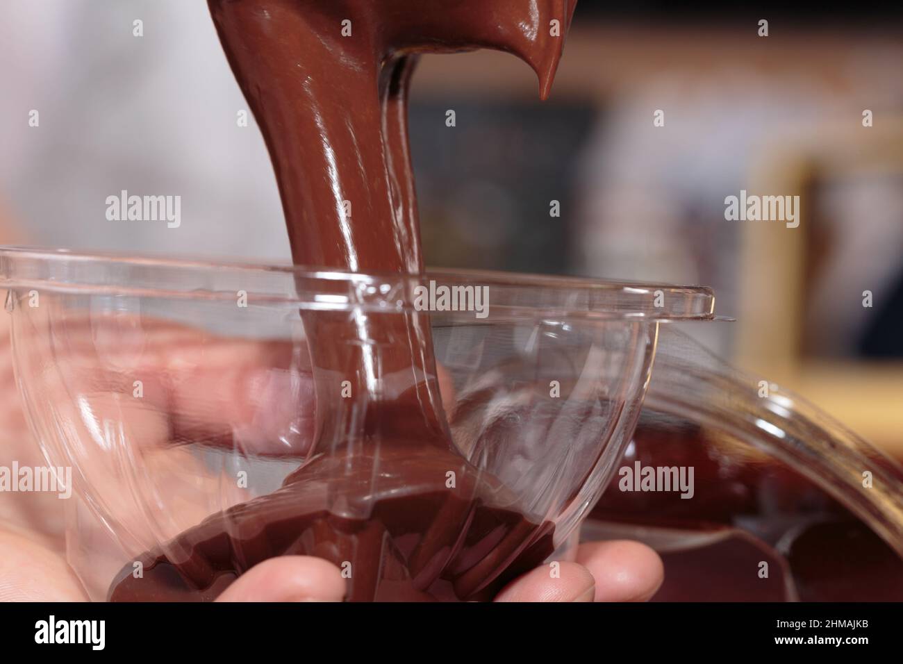 Chocolate bowl pouring chocolate hi-res stock photography and images ...