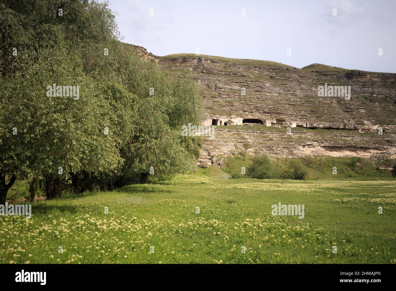 Beautiful landscape with caves in the mountainside. This is one of the ...