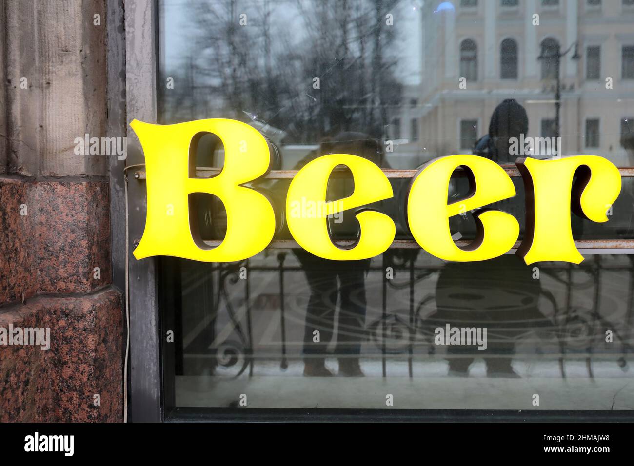 View of glowing beer sign board on window Stock Photo - Alamy