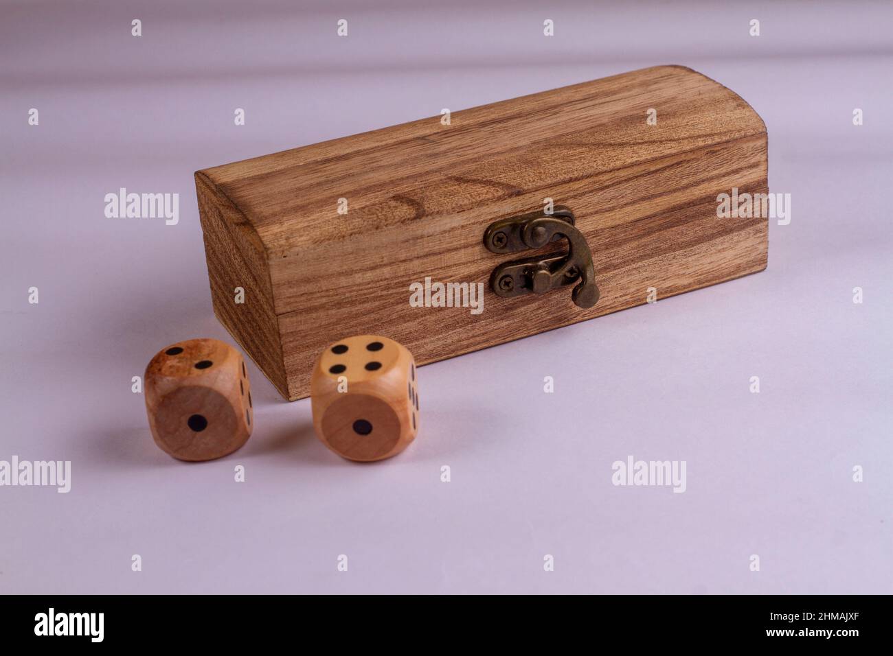 Two wooden box and dice isolated against a white background Stock Photo ...