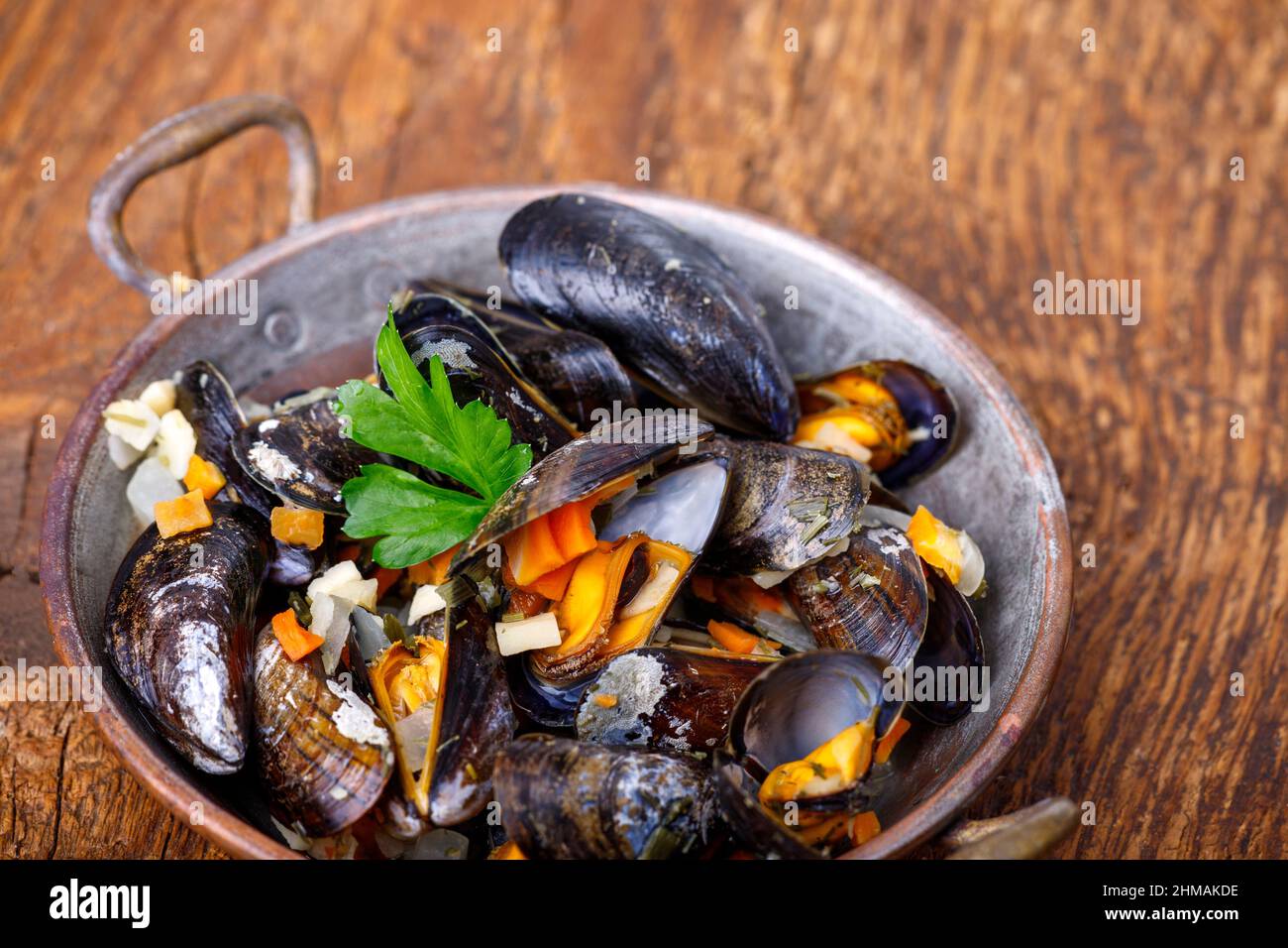 cooked mussels on dark wood Stock Photo - Alamy