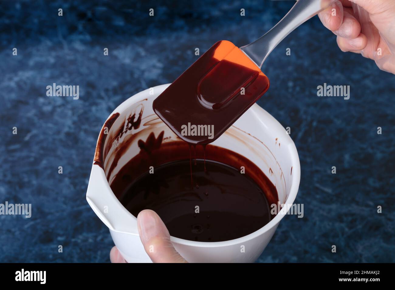 Dark chocolate melting process stirring hi-res stock photography and ...