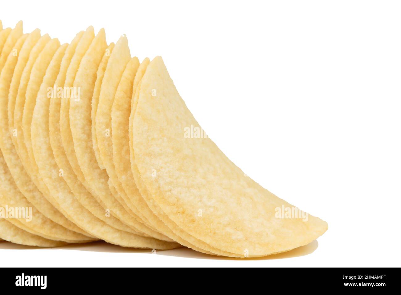 A pile of potato chips lined up in a row. Isolated over white ...