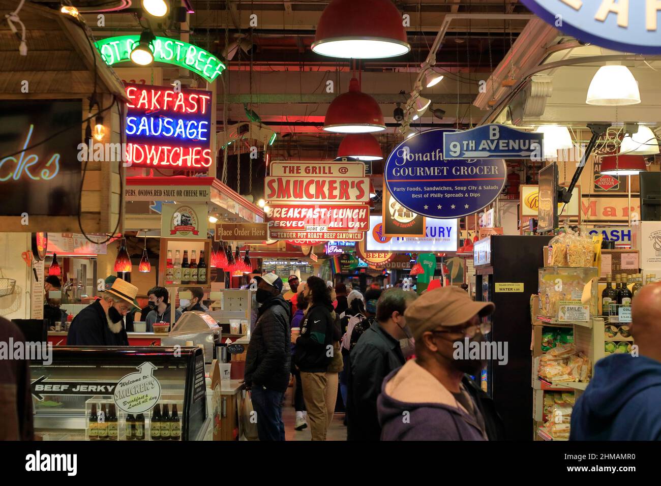 Interior view of Reading Terminal Market with customers and signs of ...
