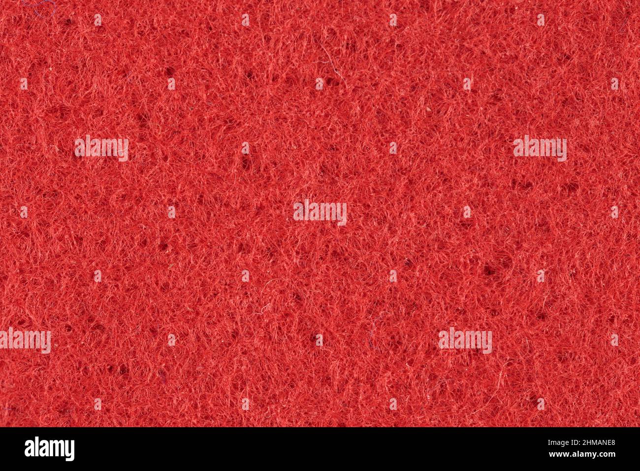 Surface made of red felt fabric texture. It occupies the entire surface ...