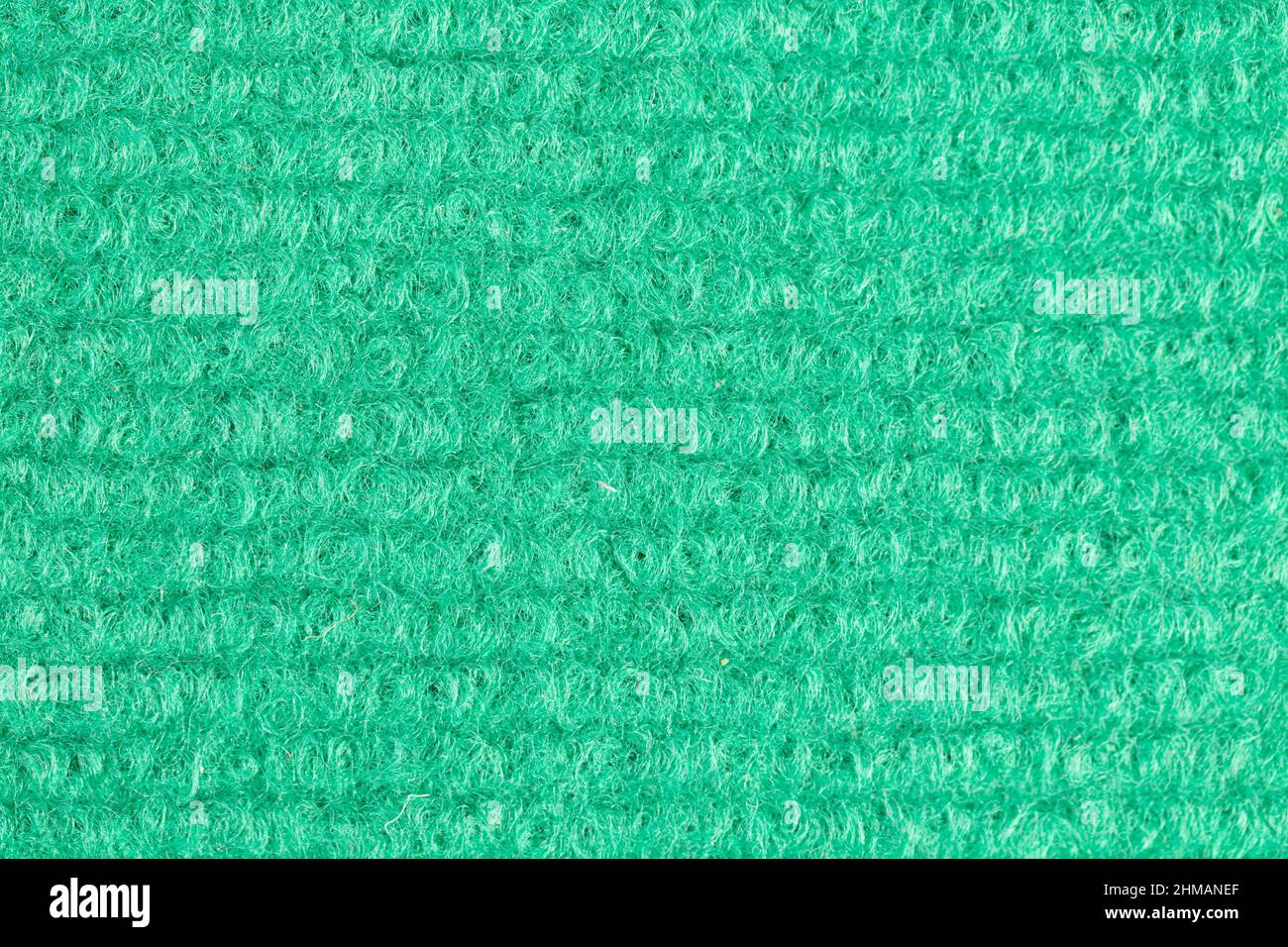 Surface made of green felt fabric texture. It occupies the entire ...