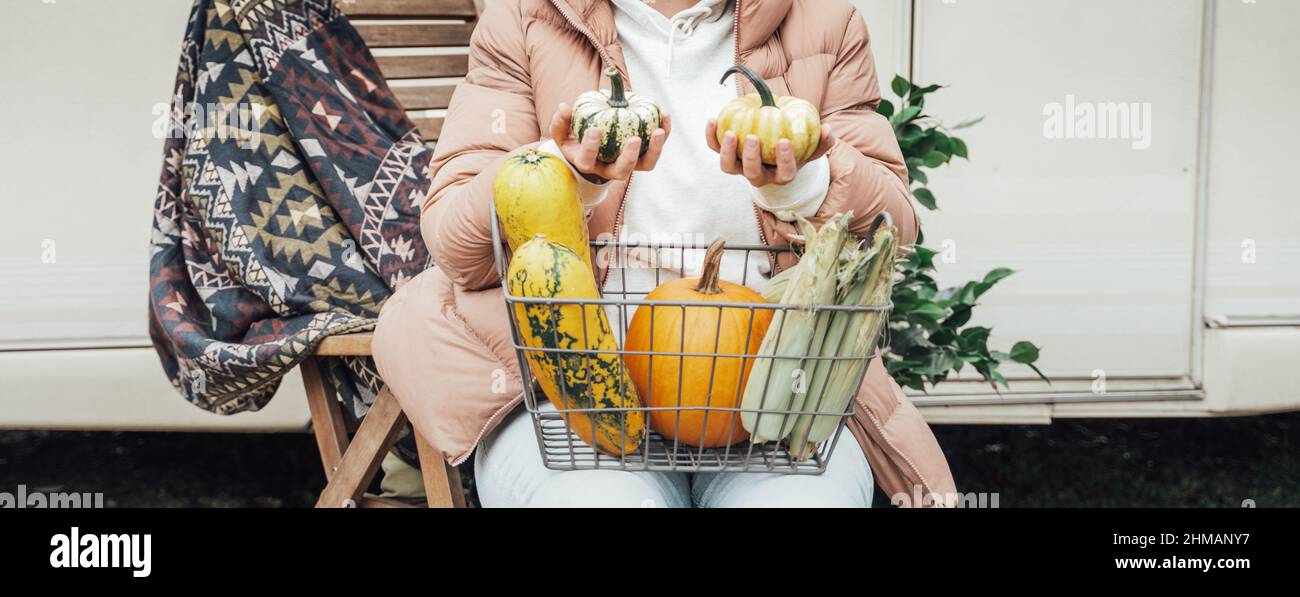 Woman with basket of autumn vegetables. Harvest in garden, farm. Ripe ...