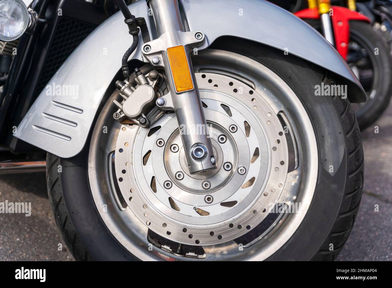 the front wheel of a motorcycle, a side view of the front wing of a ...