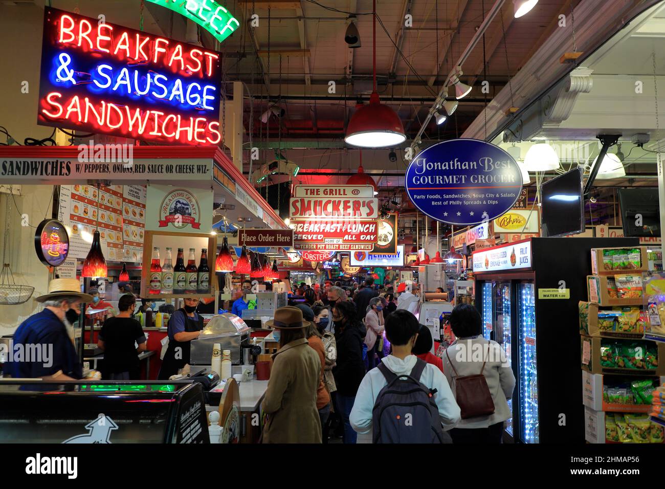 Interior view of Reading Terminal Market with customers and signs of ...