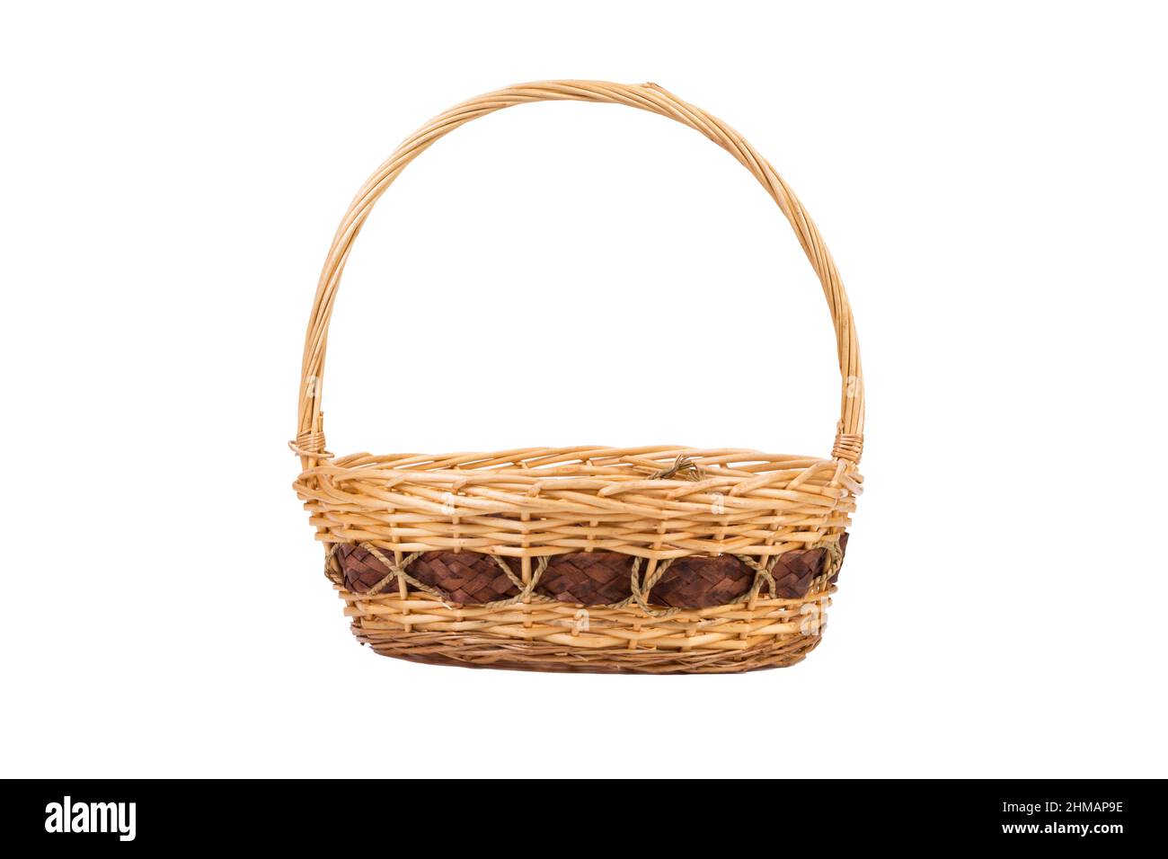 Wicker basket made of willow branches. Isolated over white background ...
