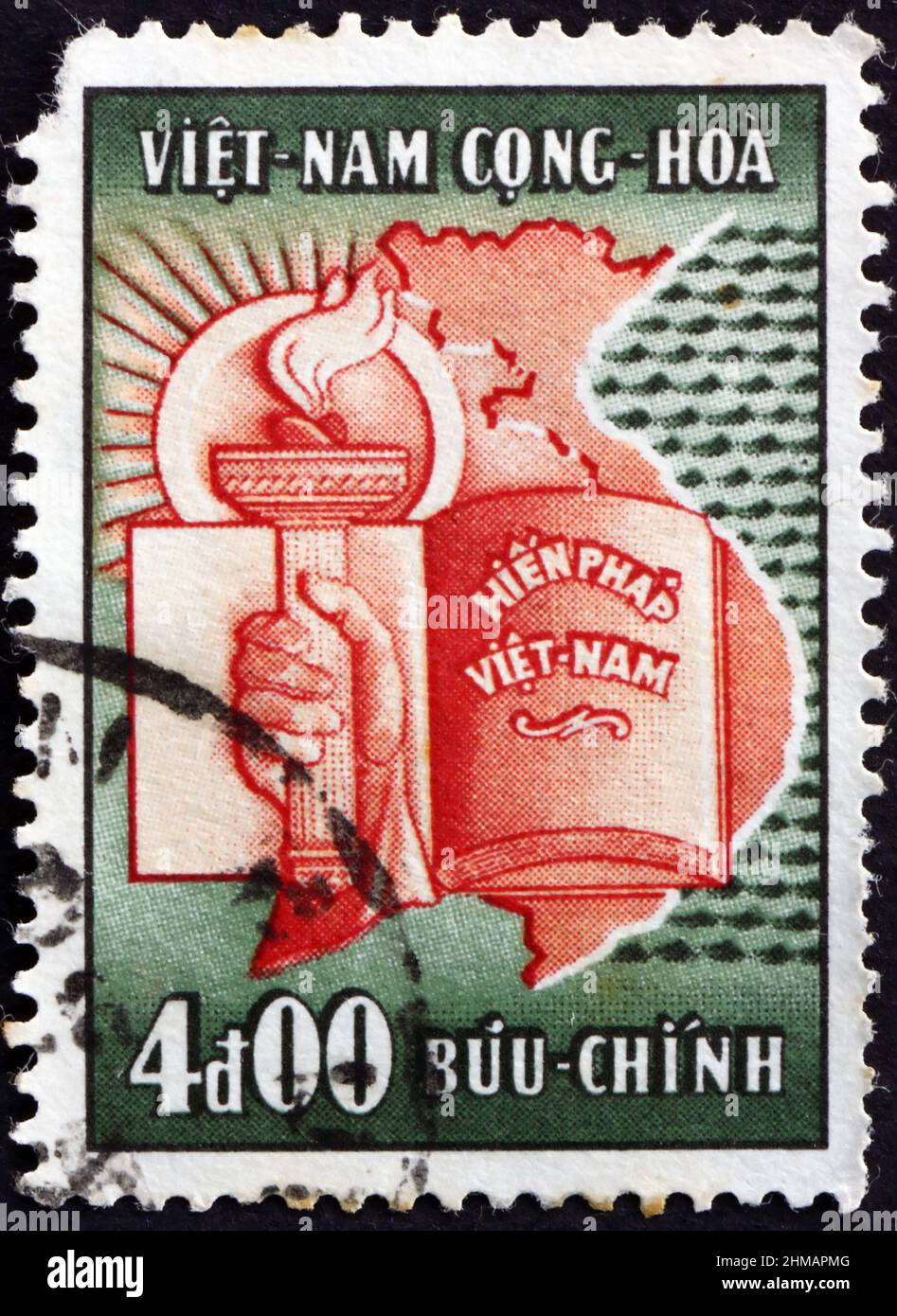 VIETNAM - CIRCA 1957: a stamp printed in Vietnam shows torch, map and ...