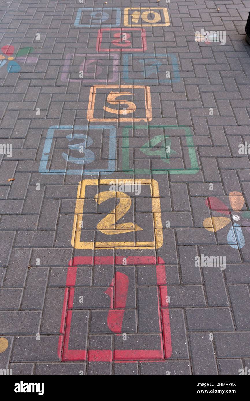 Children classics play jump. Colorful number. Game on grey city summer ...