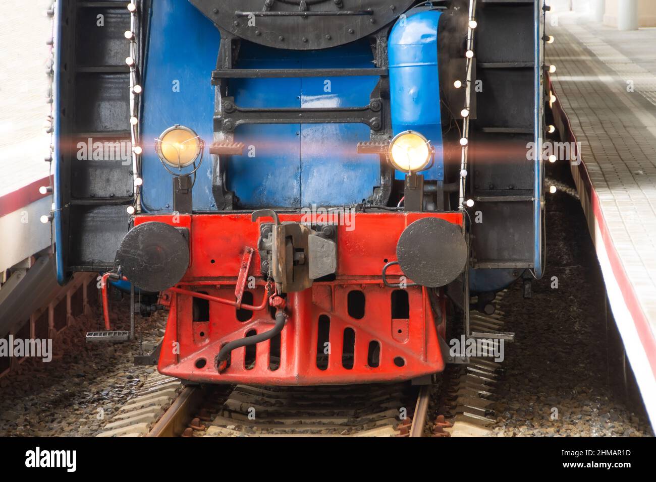 View of the lower red grille bumper of a locomotive on rails Stock ...