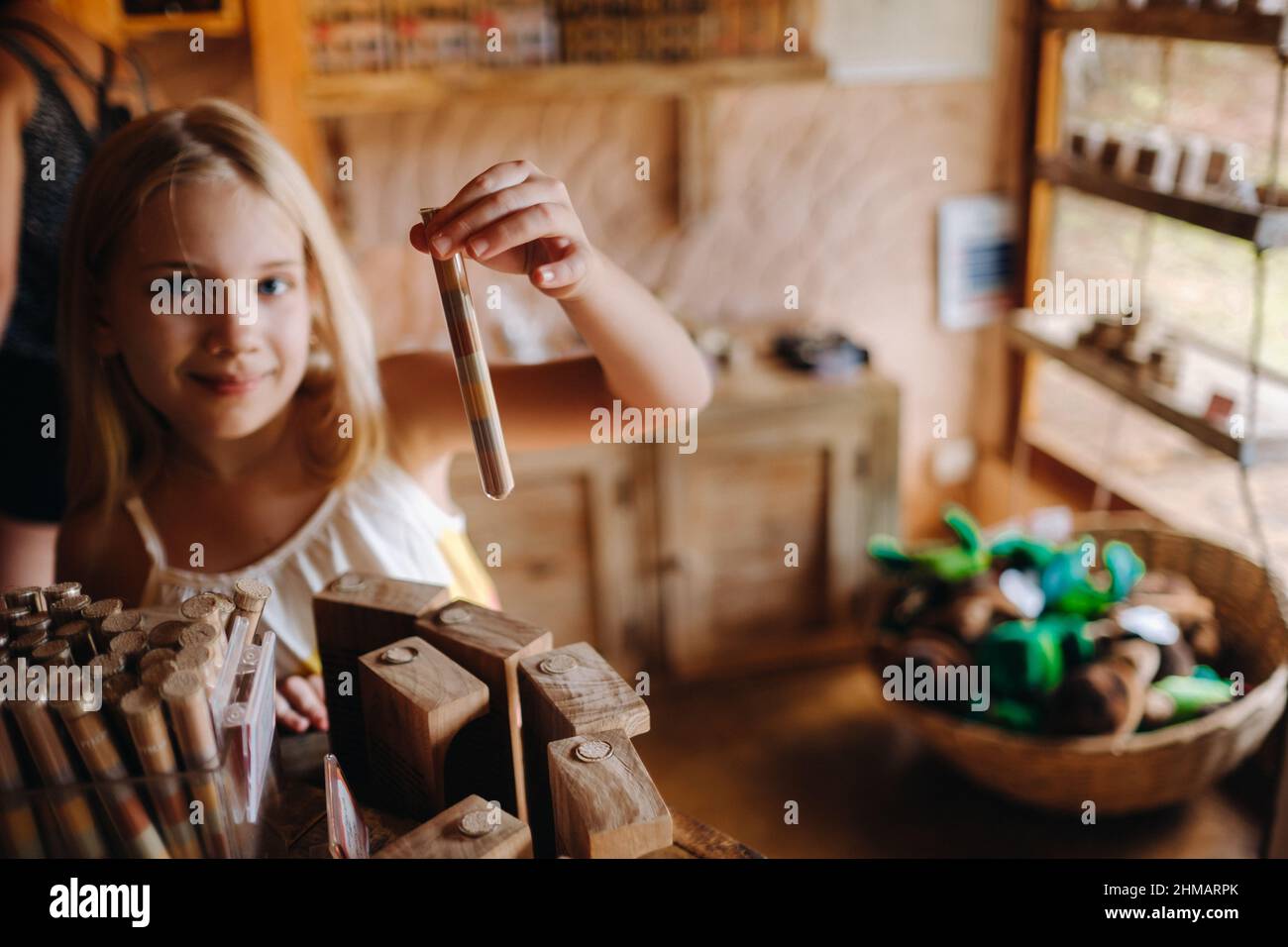 Little girl holding a flask with the seven Sands from the gift shop ...