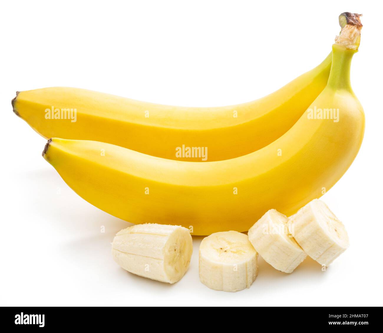 Yellow bananas and banana slices. Objects are isolated on white ...