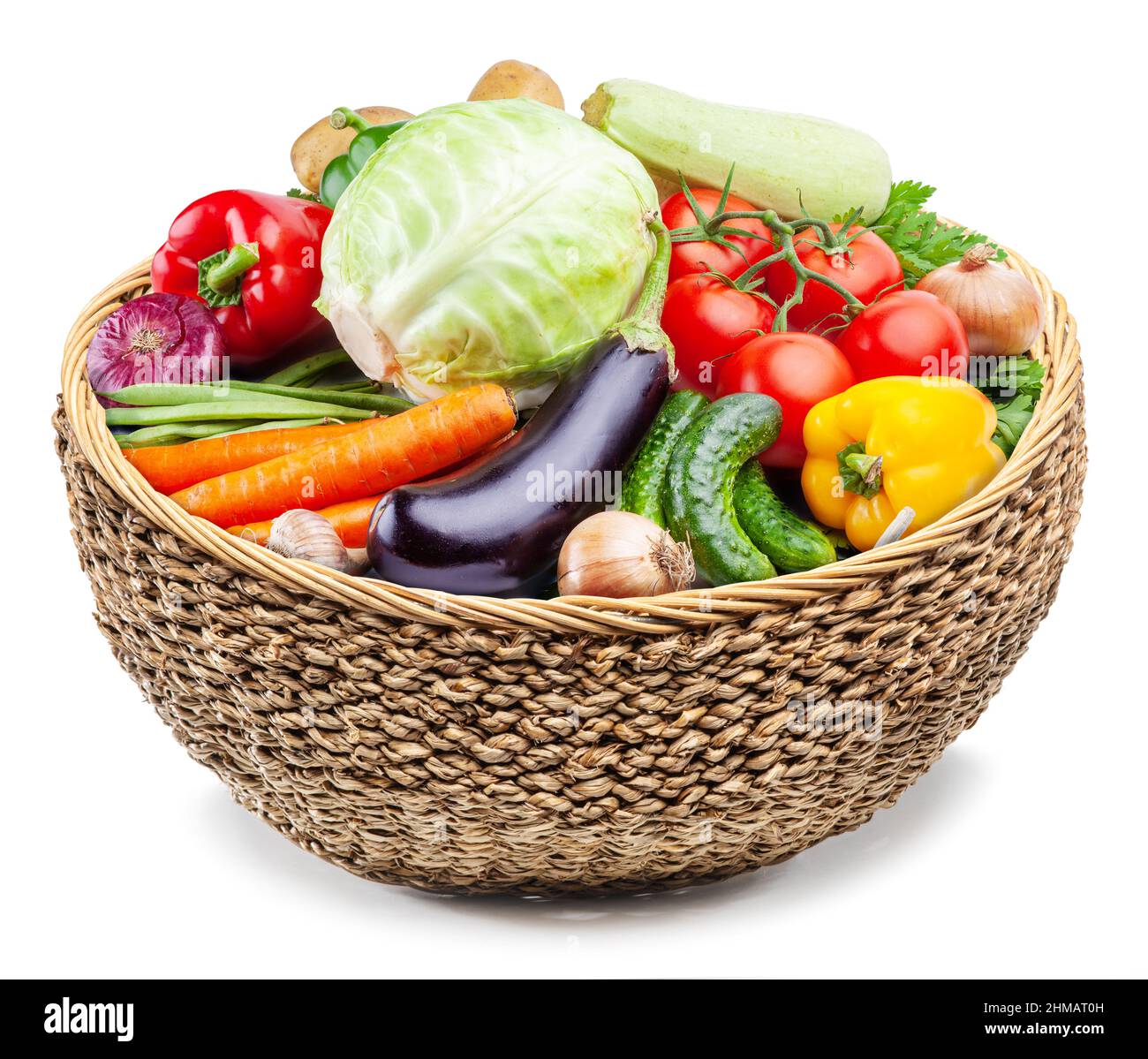 Food basket. Vast of different vegetables in the wicker basket on white ...