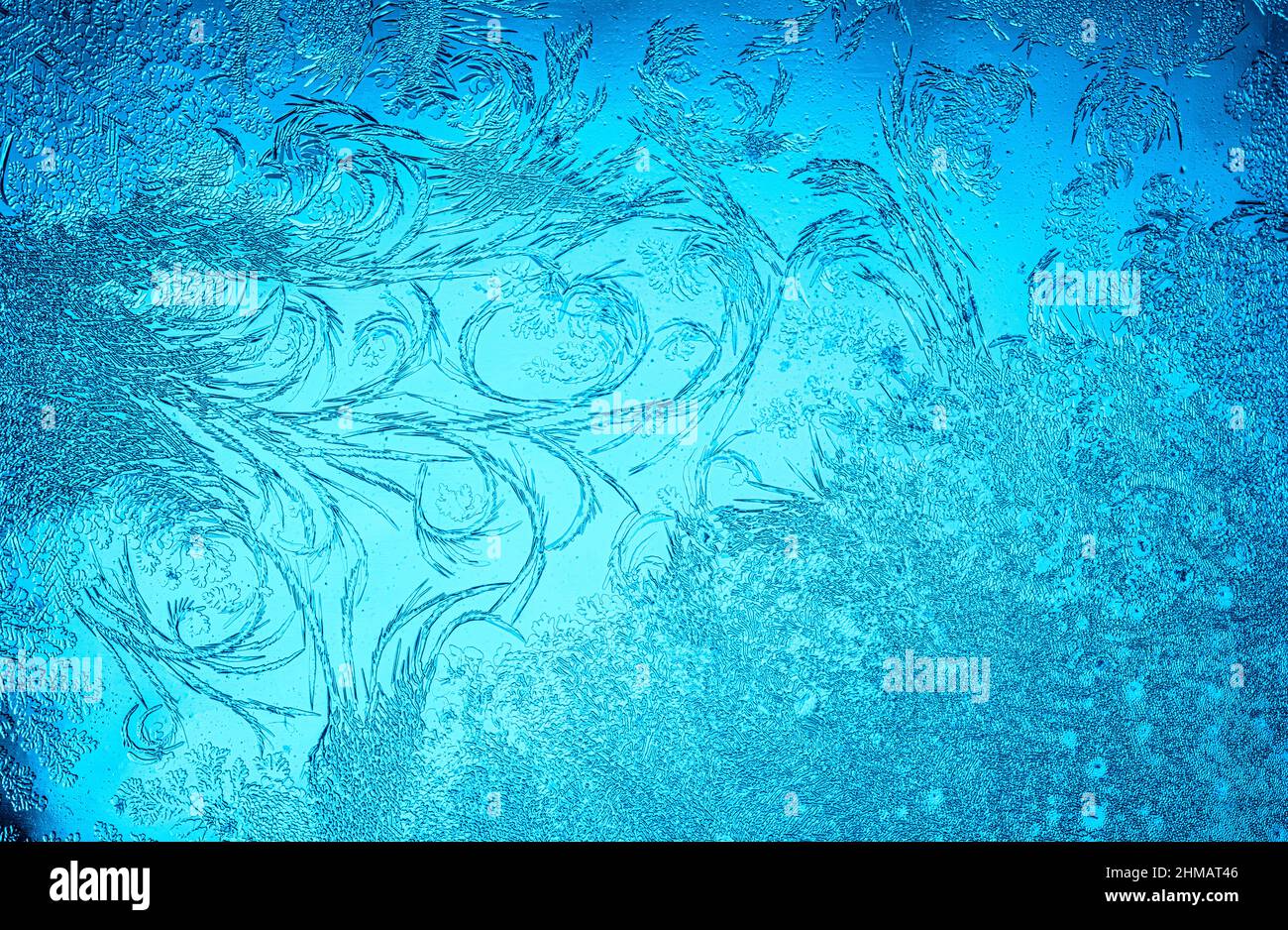 Beautiful blue frost patterns on frozen window as a symbol of Christmas ...