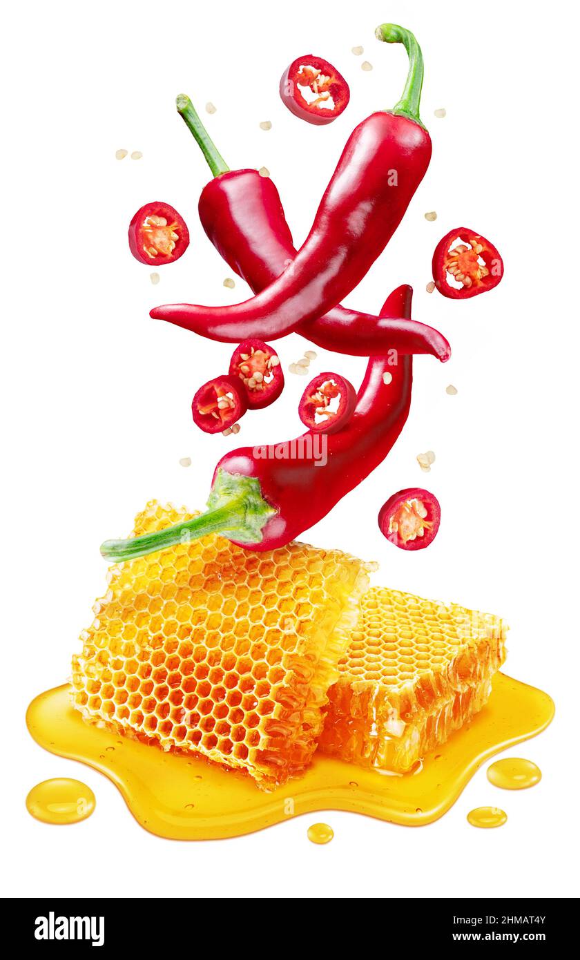 Fresh red chilli pepper and sections of chilli pepper floating over ...