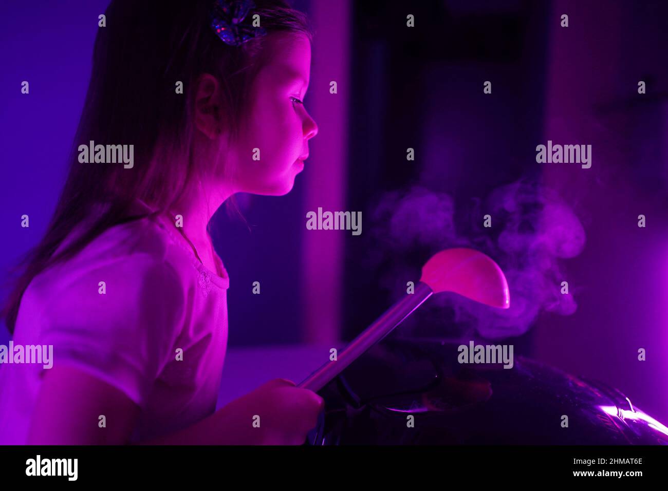 girl with a ladle cooks, steam pleasant smell Stock Photo - Alamy