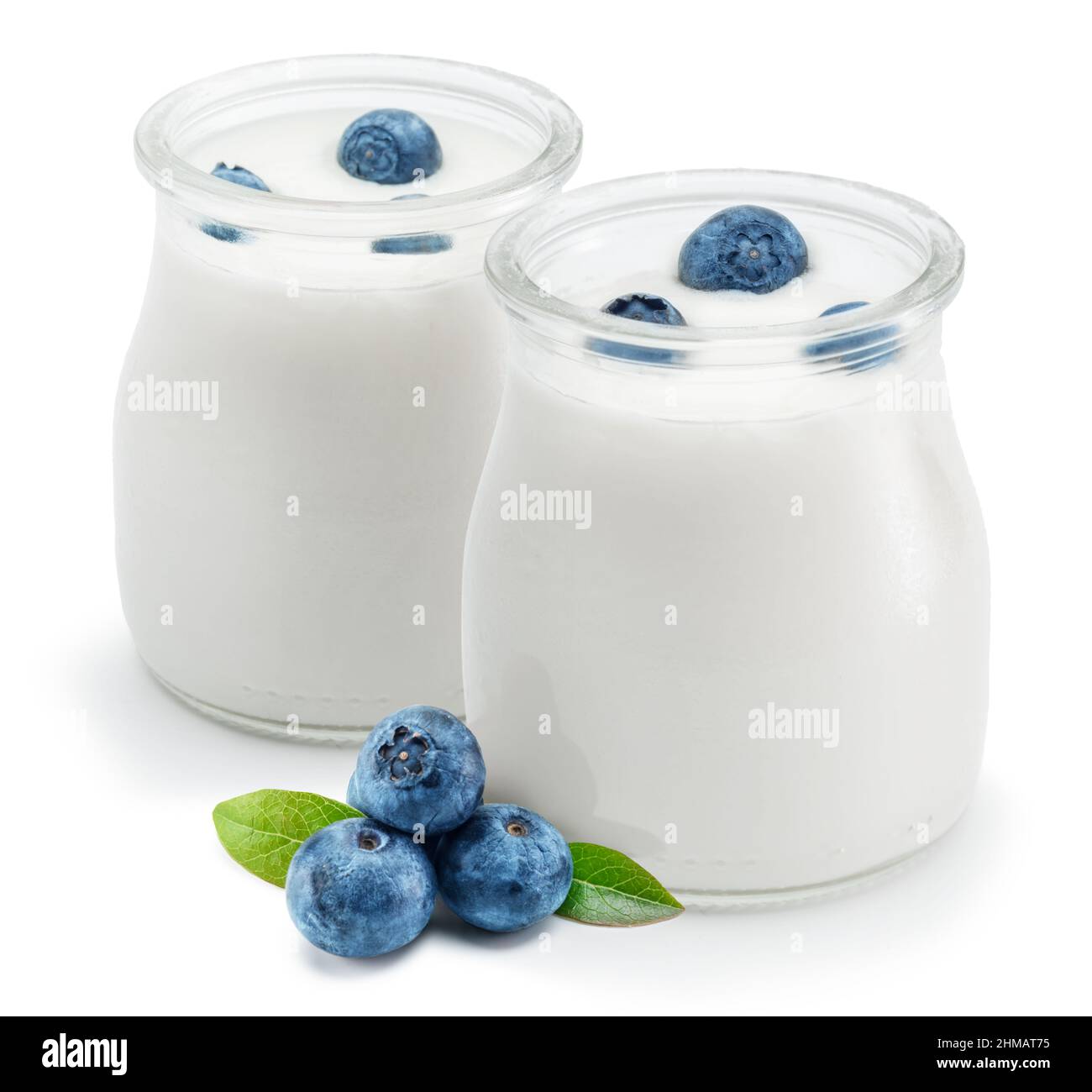 Two glass containers with plain yoghurt and berries isolated on white ...