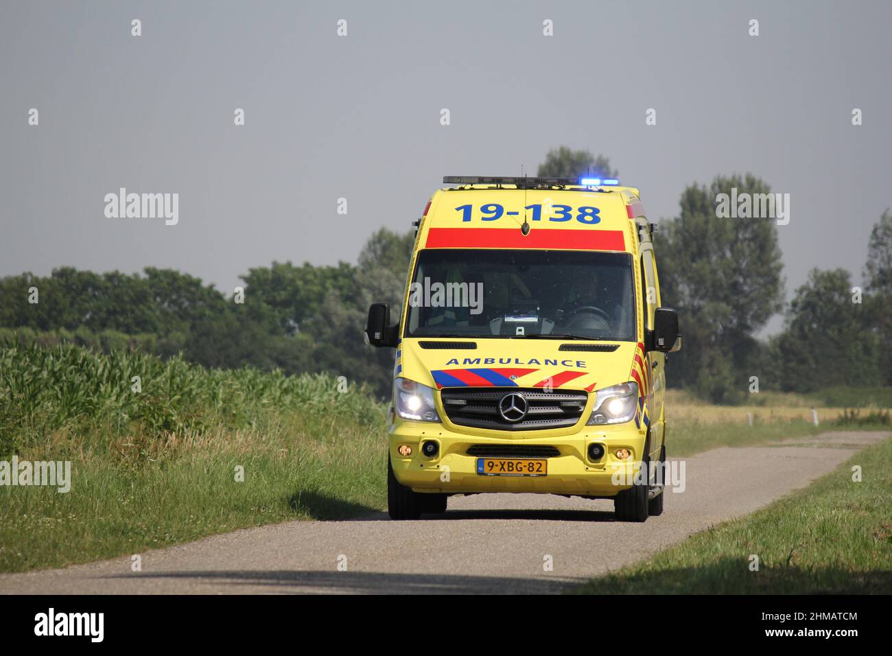 an ambulance drives in the dutch countryside in springtime Stock Photo ...