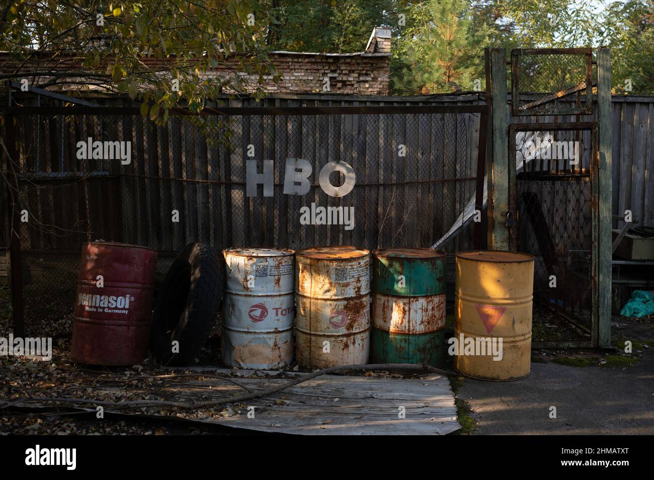 Abandoned facilities, tools, vehicles and garbage lie near the once ...