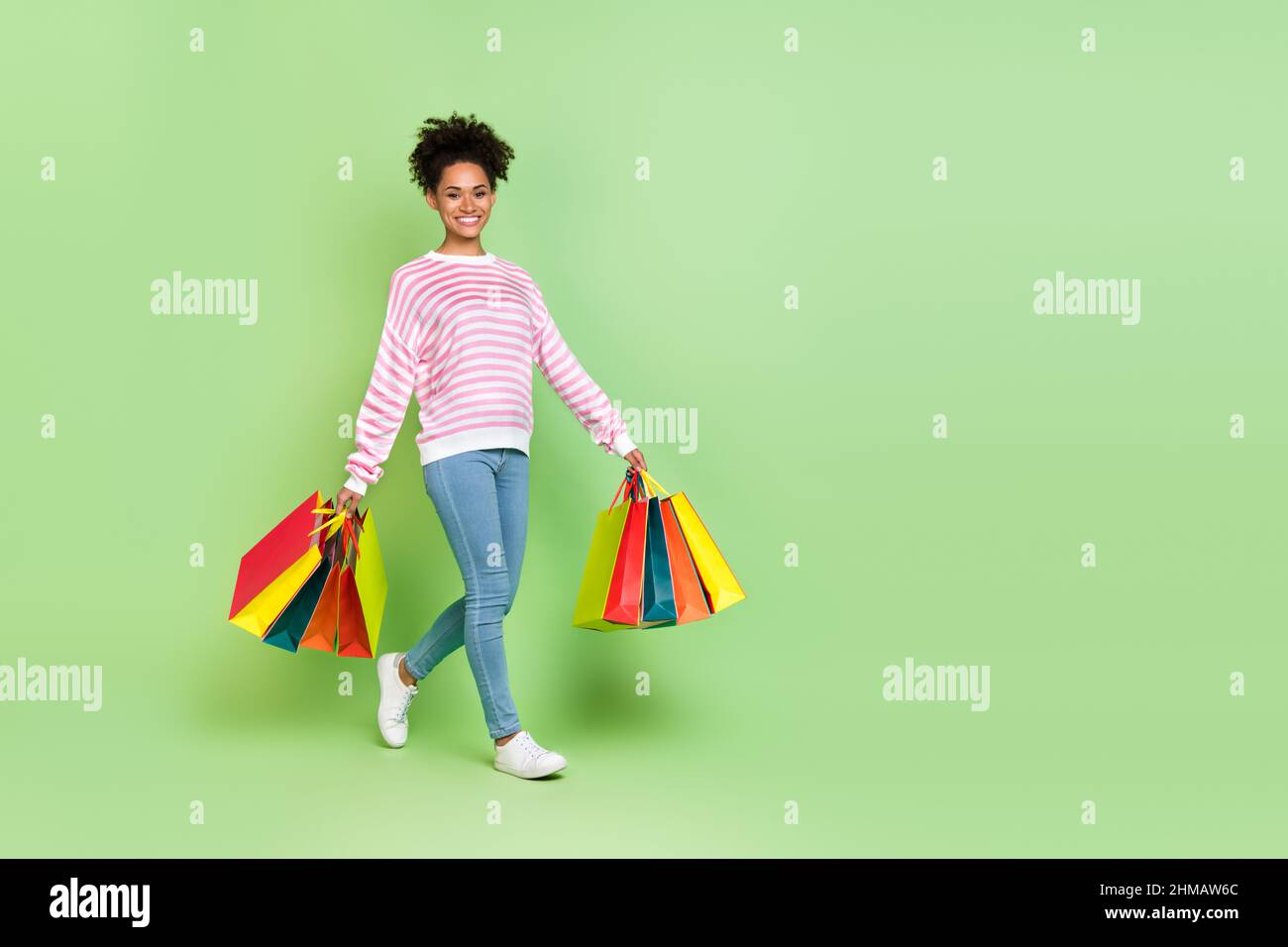 Photo of charming pretty lady hold store packages enjoy stroll wear ...