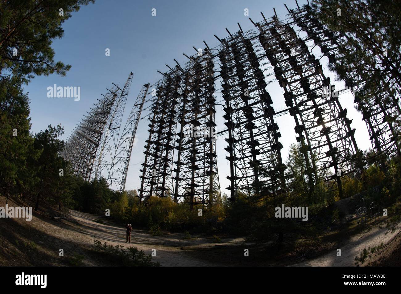 A man stands in front of the powerful and once secret Soviet Duga radar ...