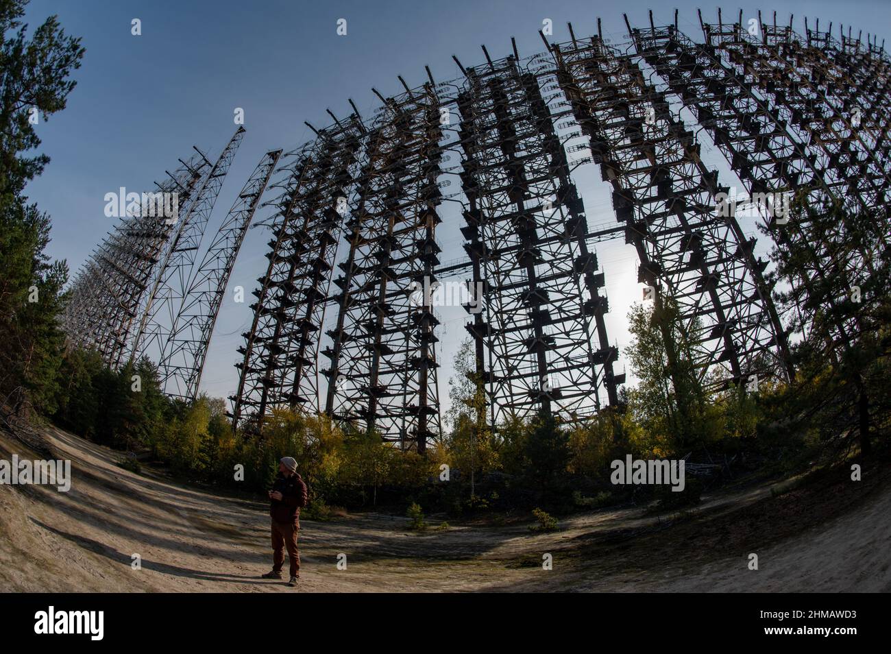A man stands in front of the powerful and once secret Soviet Duga radar ...